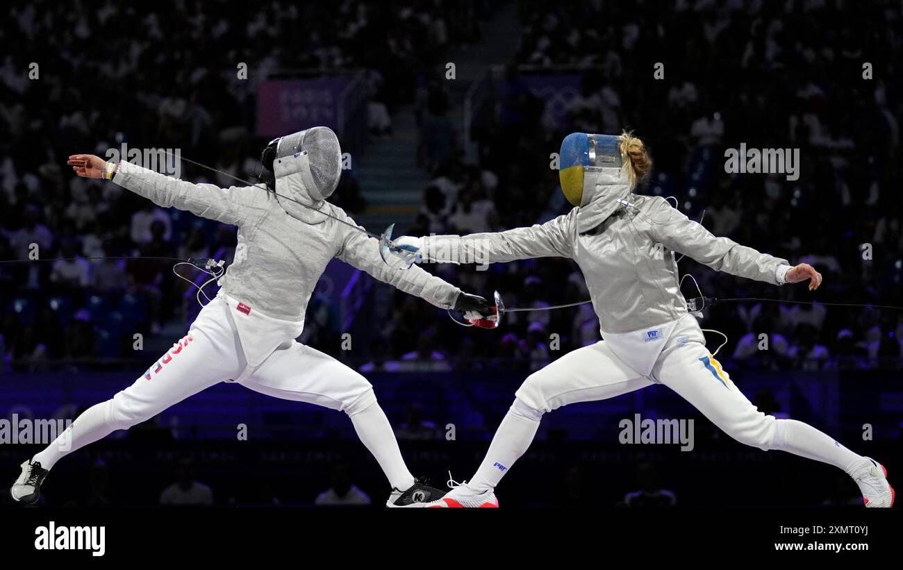 South Korea's Choi Sebin, left, competes with Ukraine's Olga Kharlan in ...