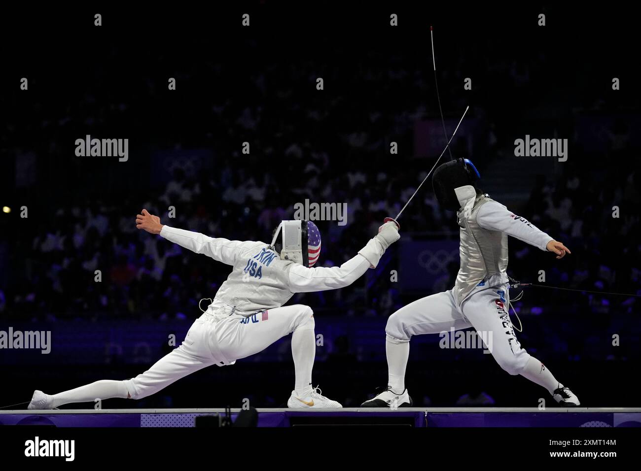 Japan's Kazuki Iimura, right, competes with United State's Nick Itkin ...