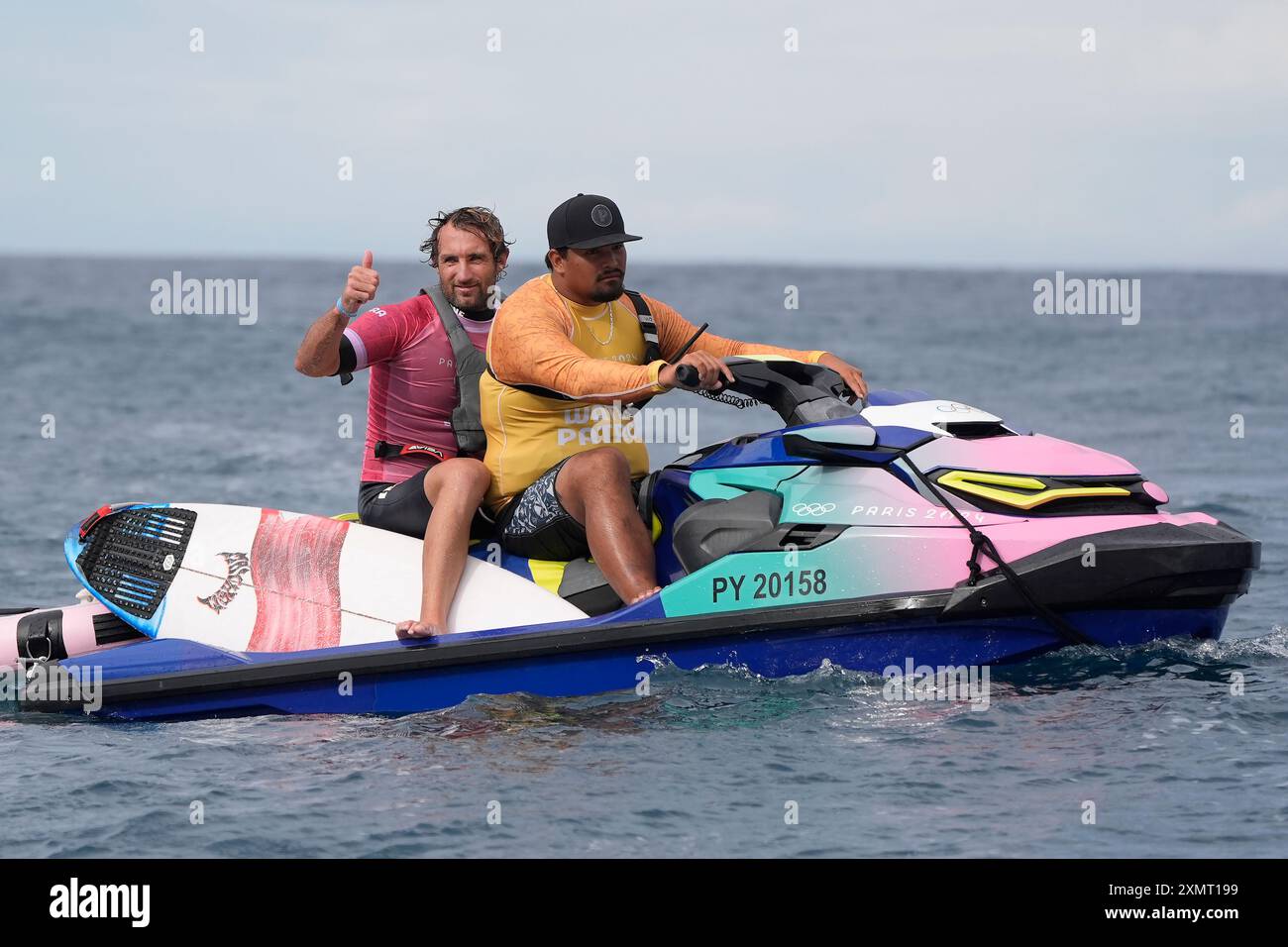 Joan Duru, of France, left, gestures after winning his heat during the ...