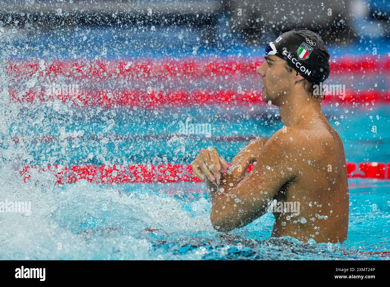 Thomas Ceccon, of Italy, reacts after winning the men's 100-meter ...