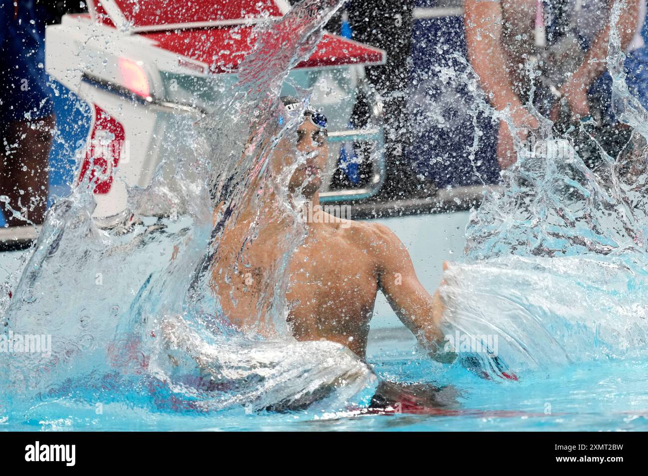 Thomas Ceccon, of Italy, celebrates after winning the men's 100-meter ...