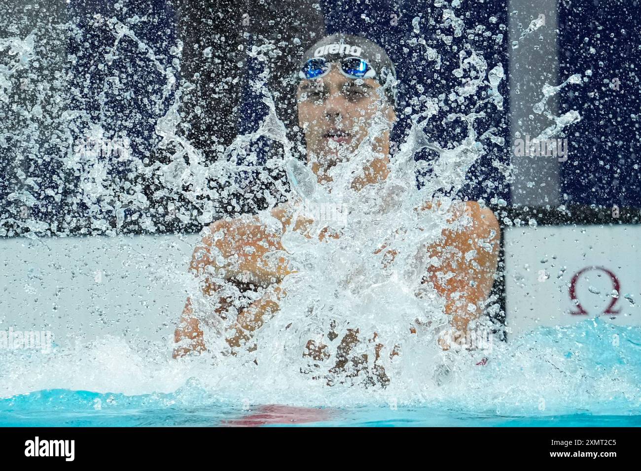 Thomas Ceccon, of Italy, celebrates after winning the men's 100-meter ...