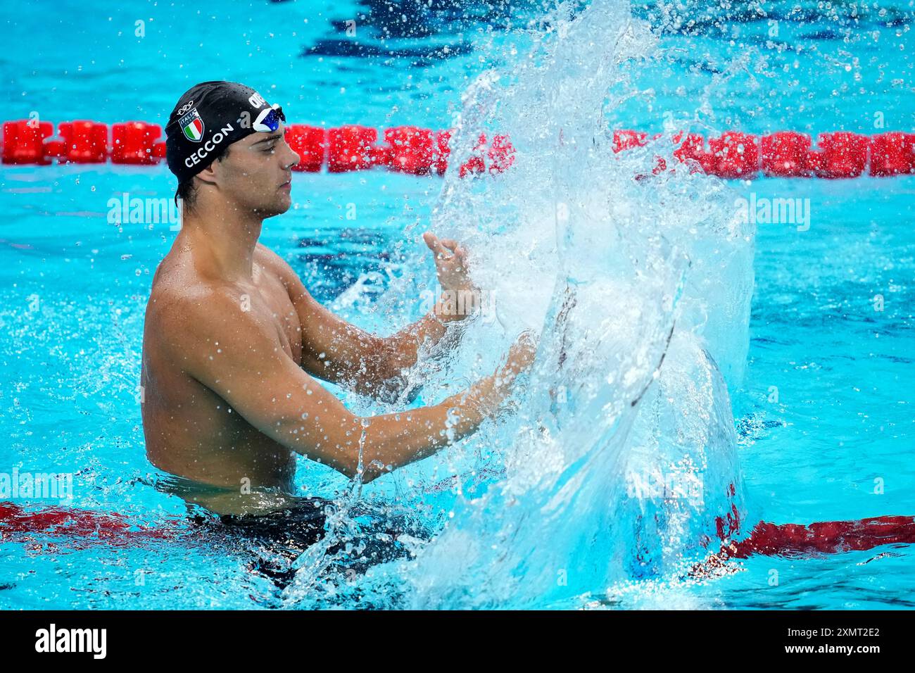 Thomas Ceccon, of Italy, celebrates after winning the men's 100-meter ...