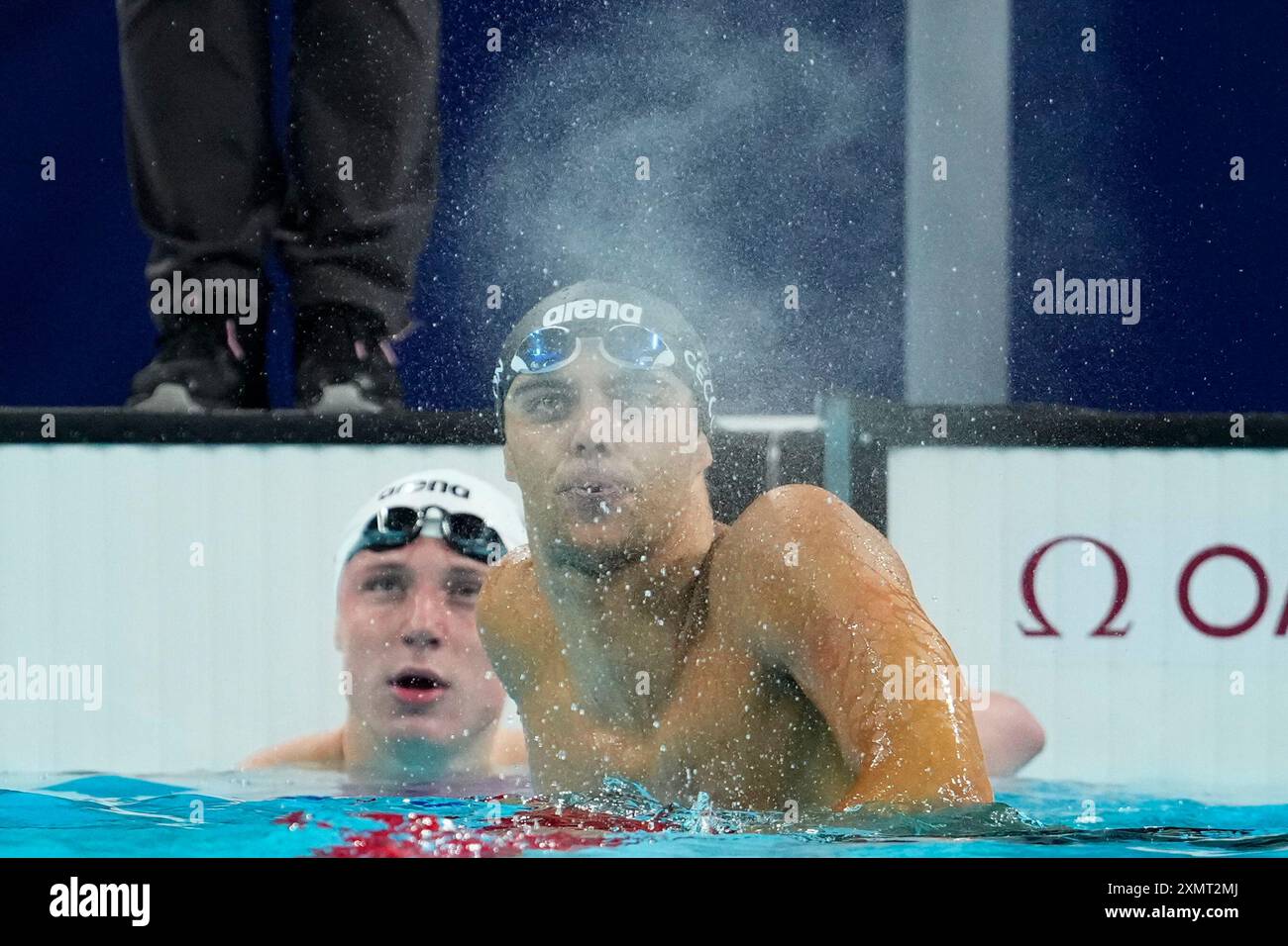 Thomas Ceccon, of Italy, reacts after winning the men's 100-meter ...