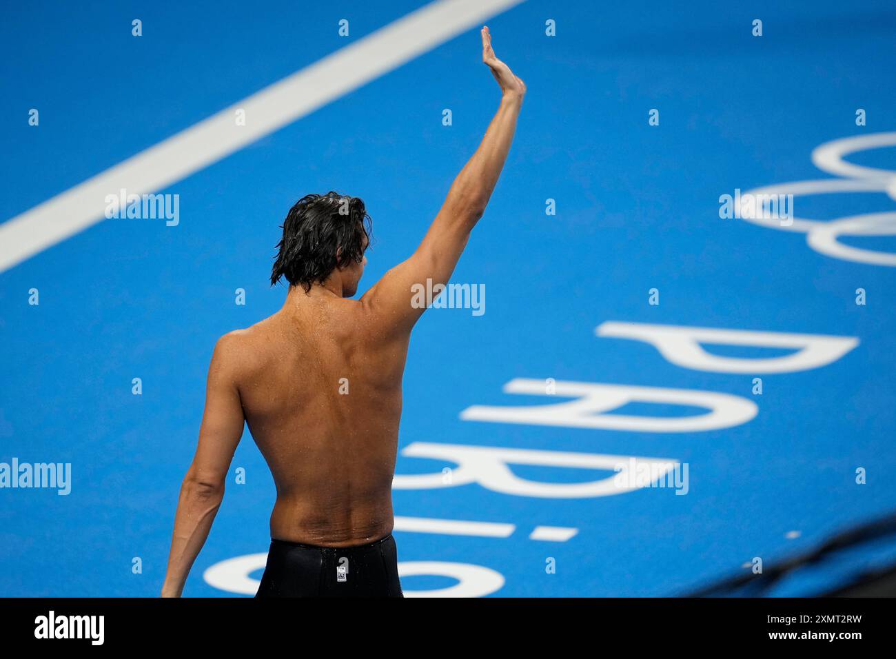 Thomas Ceccon, of Italy, celebrates after winning the men's 100-meter ...