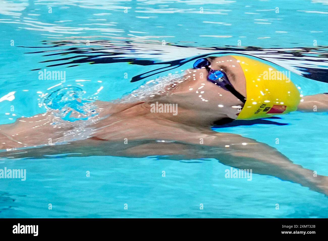 Xu Jiayu, of China, competes in the men's 100-meter backstroke final at ...