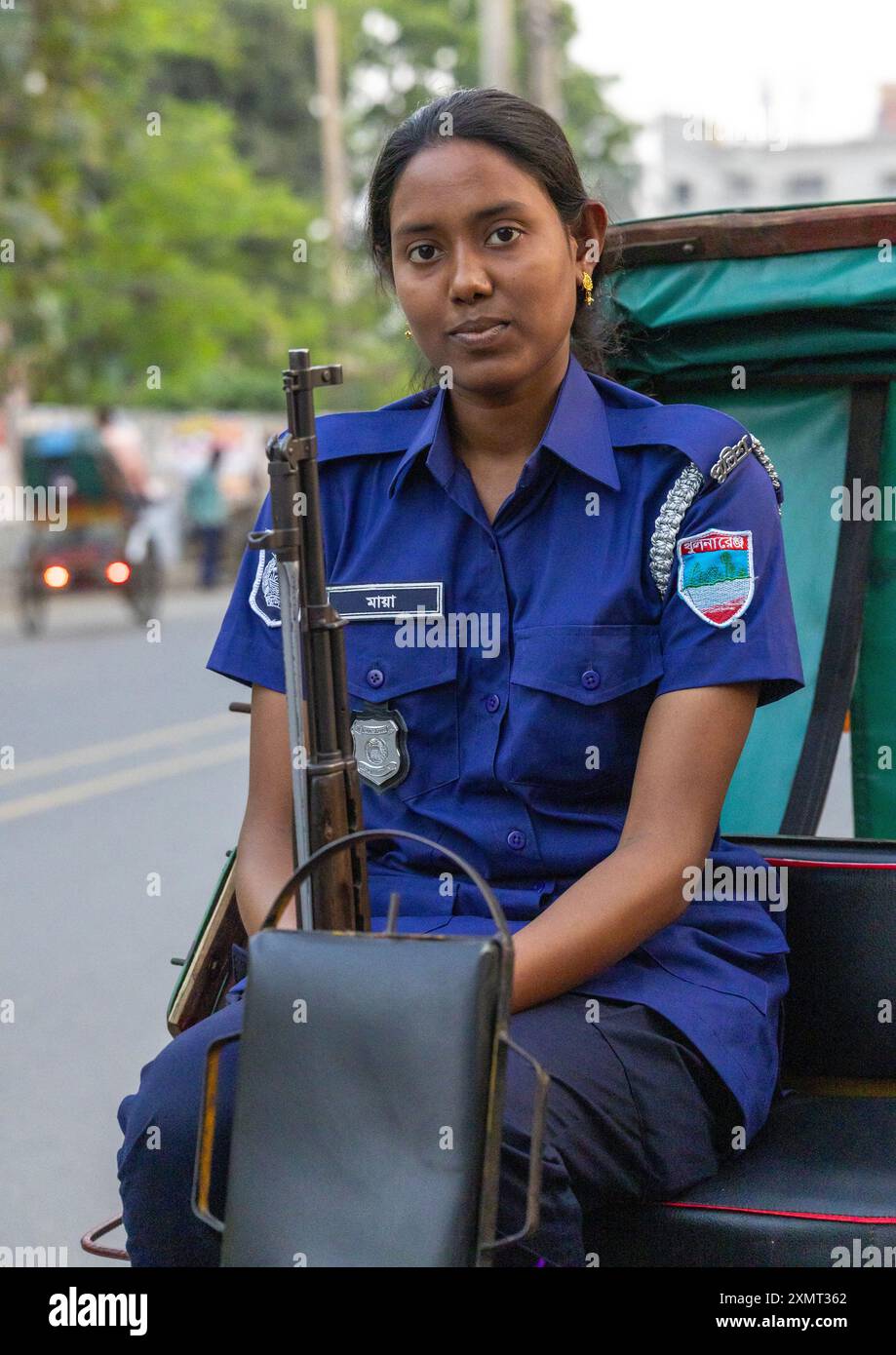 Portrait of a police woman with a gun, Khulna Division, Jessore ...