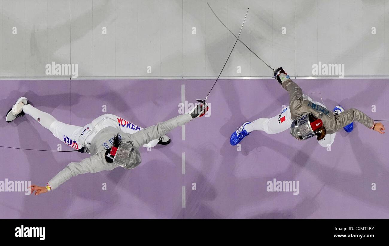 South Korea's Choi Sebin, left competes with France's Manon Apithy ...