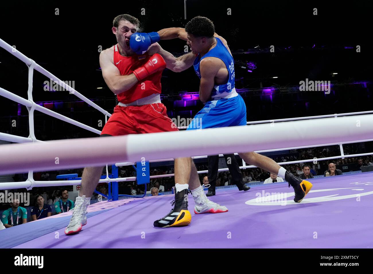 Britain's Delicious Orie hits Armenia's Davit Chaloyan in their men's ...