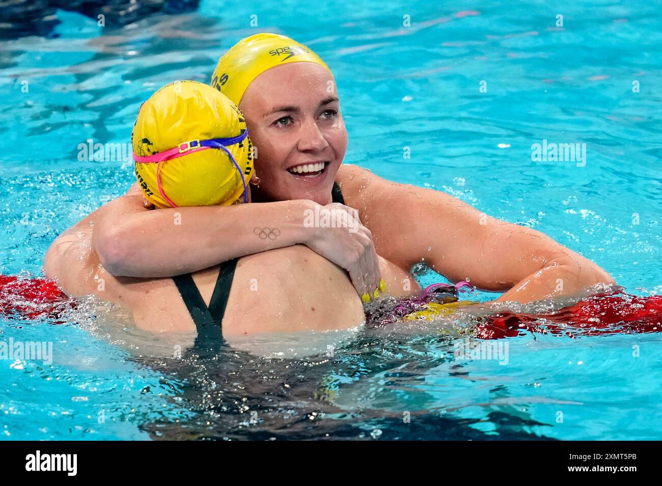 Mollie O'Callaghan, left, of Australia, celebrates with Ariarne Titmus ...