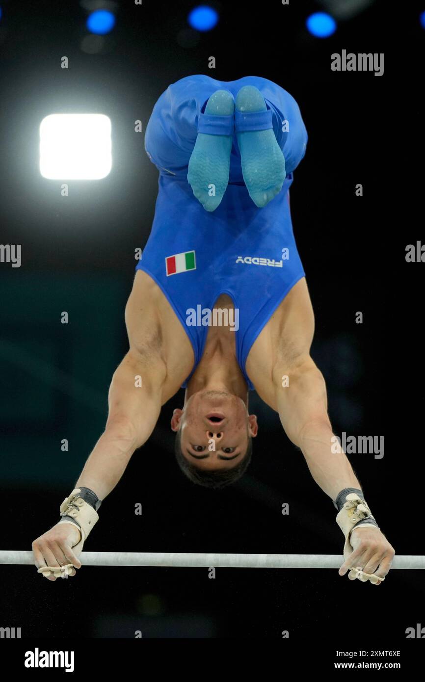 Yumin Abbadini, of Italy, performs on the horizontal bar during the men ...