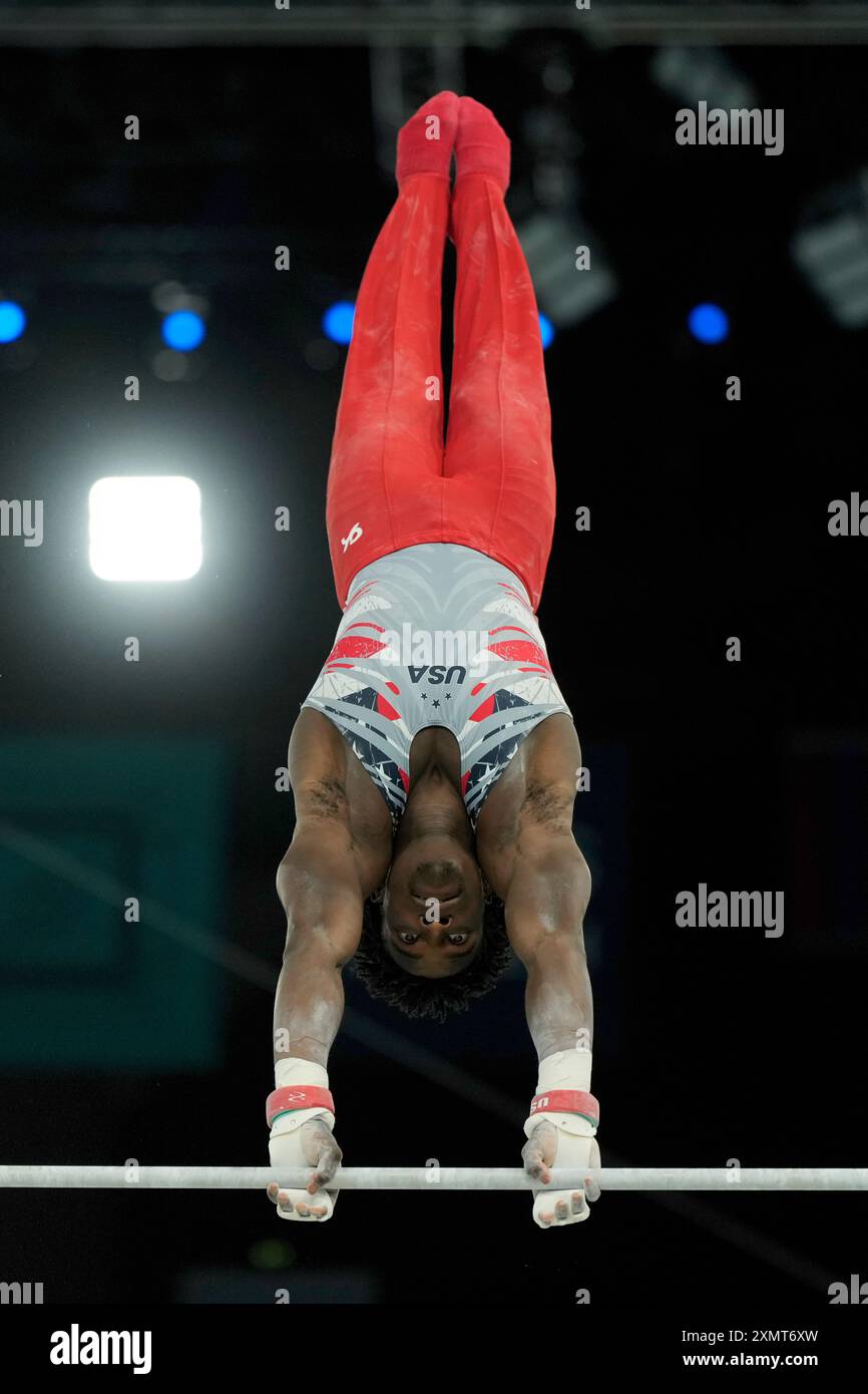 Frederick Richard, of United States, performs on the horizontal bar ...