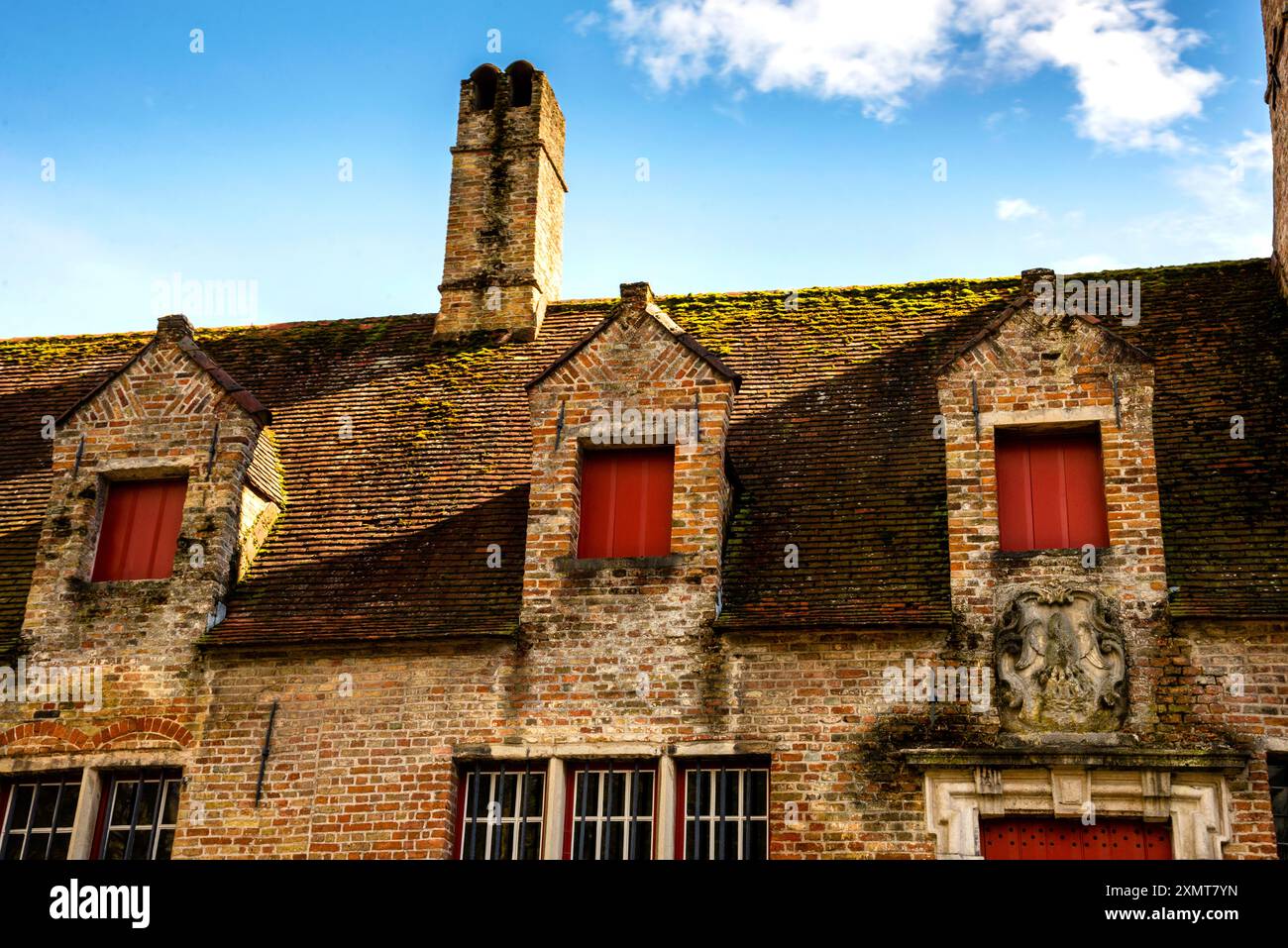 Medieval brick dormers of Almshouses De Pelikaan in Bruges, Belgium ...