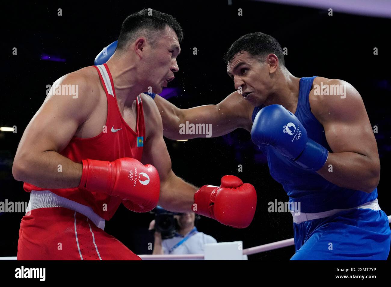 Spain's Ayoub Ghadfa hits Kazakhstan's Kamshybek Kunkabayev in their ...