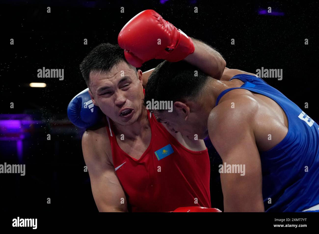 Spain's Ayoub Ghadfa, right, hits Kazakhstan's Kamshybek Kunkabayev in ...