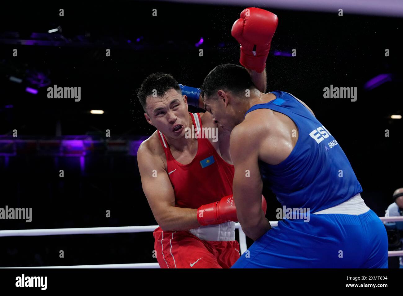 Spain's Ayoub Ghadfa, right, hits Kazakhstan's Kamshybek Kunkabayev in ...