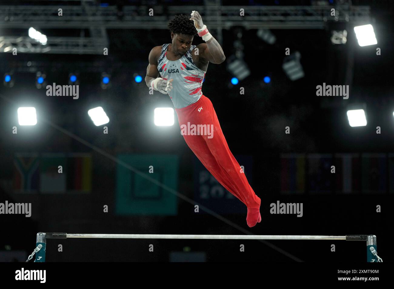 Frederick Richard, of United States, performs on the horizontal bar ...