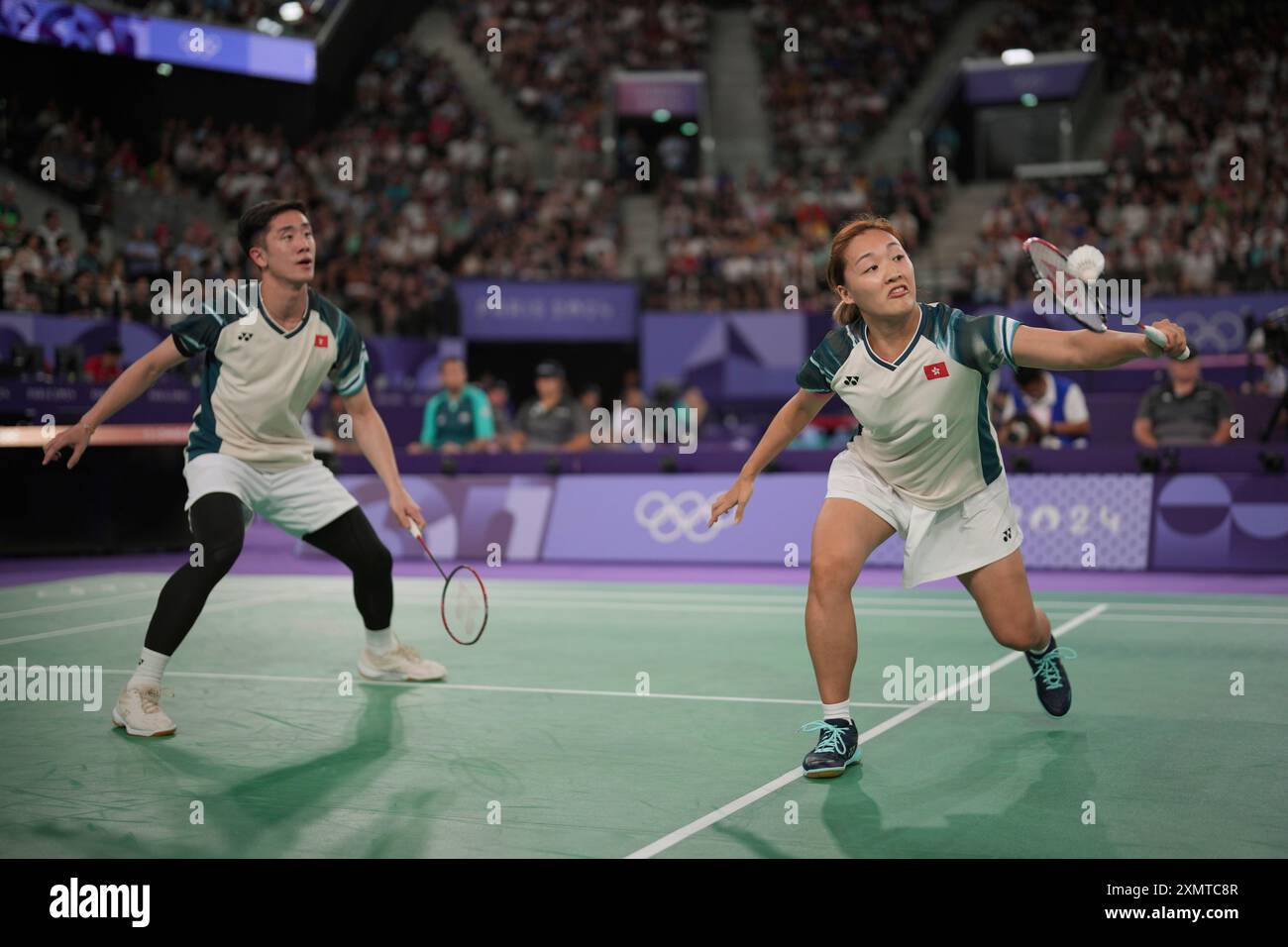 Hong Kong's Tang Chun Man, left, and Tse Ying Suet play against Japan's ...