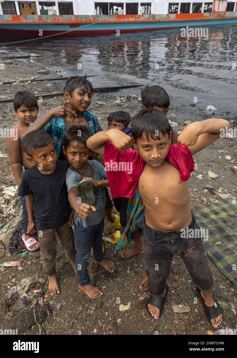 Bangladeshi grueur boys on a riverbank, Dhaka Division, Keraniganj ...