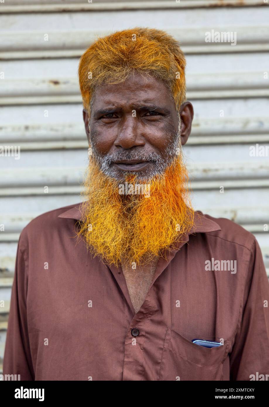 Portrait of a bangladeshi man with beard and hair dyed in henna, Dhaka ...
