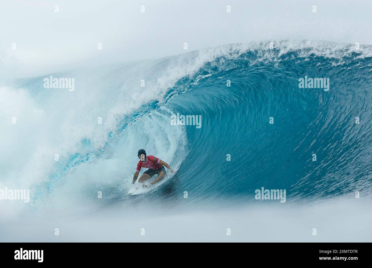 Brazil's Joao Chianca gets a barrel in the sixth heat of the men's ...