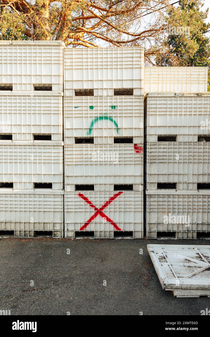 white storage containers at winery with sad face and an x Stock Photo ...