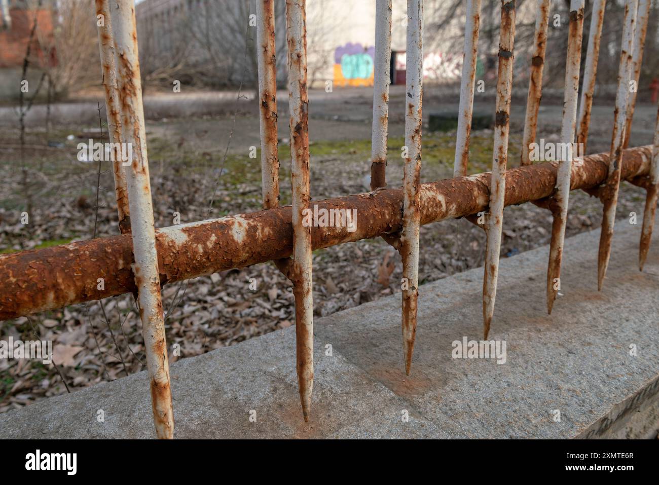 old rusty fence, with signs of age and neglect, work to remove the rust ...