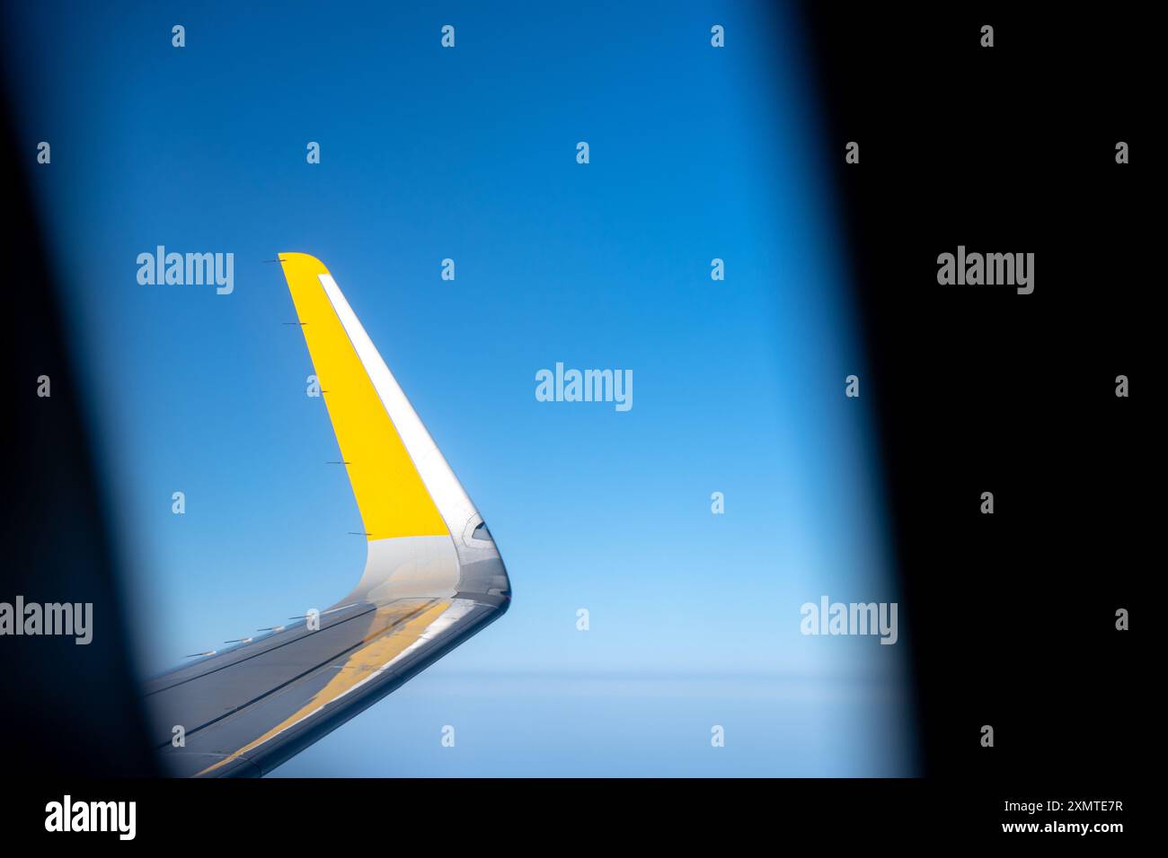 Horizontal View of Yellow Airplane Wing from Inside the Cabin Stock ...
