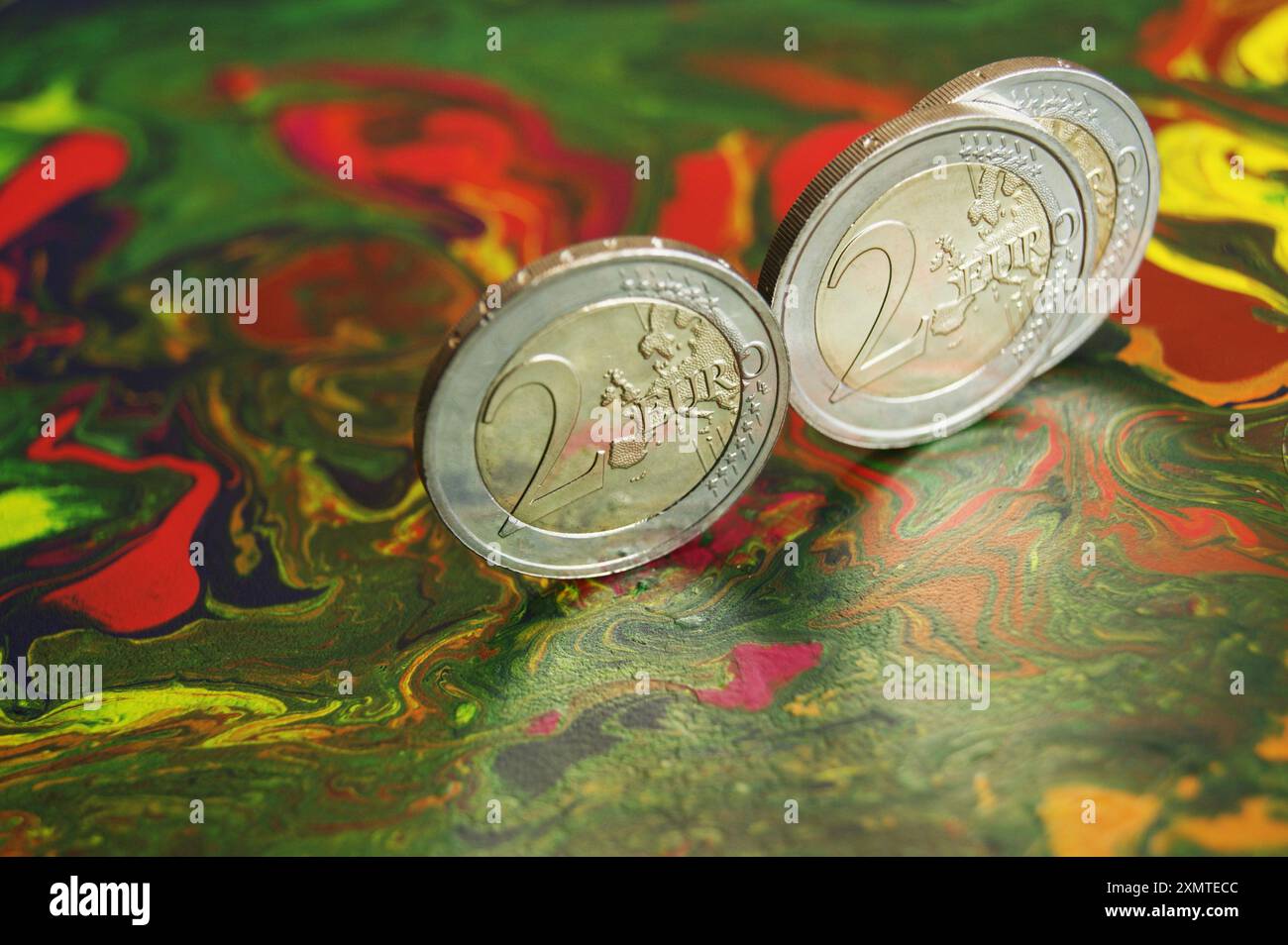 Proof 2 euro coins on a mottled abstract surface Stock Photo - Alamy