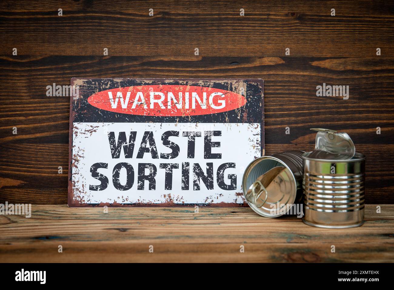 Waste Sorting Concept. Warning sign and metal cans on wooden texture ...
