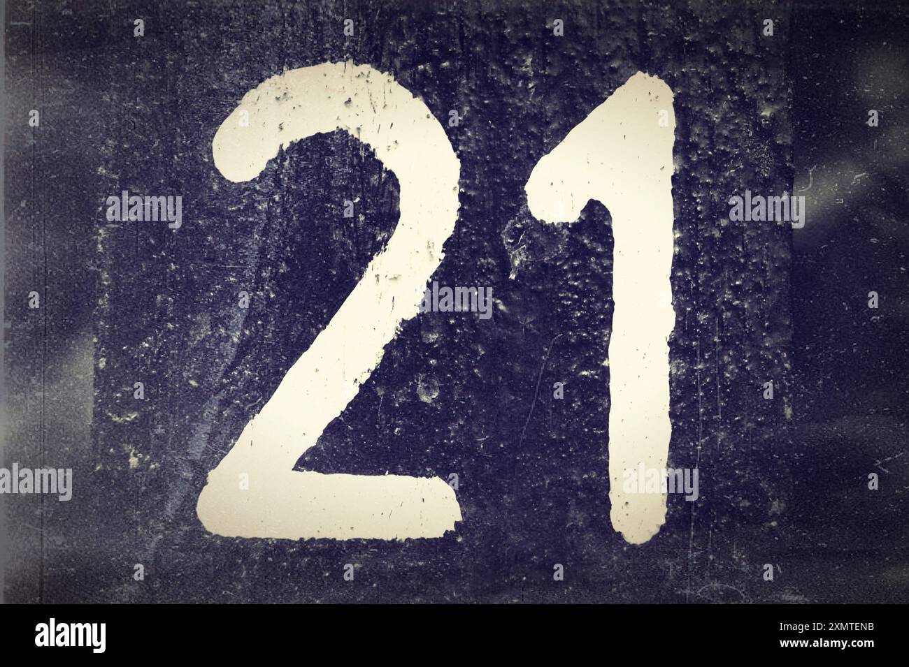 Number 21, White number on a dark background. Black and white old photo ...