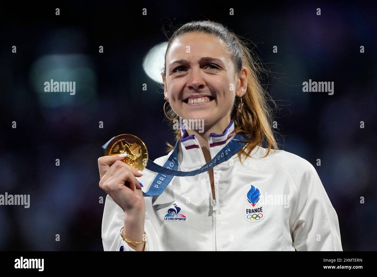 France's Manon Apithy Brunet celebrates on the podium after winning the ...