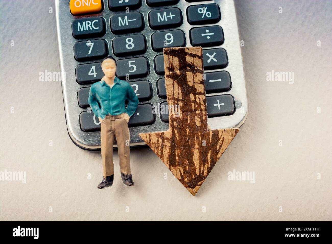 Mean figurine and arrow on Calculator device with a keyboard Stock ...