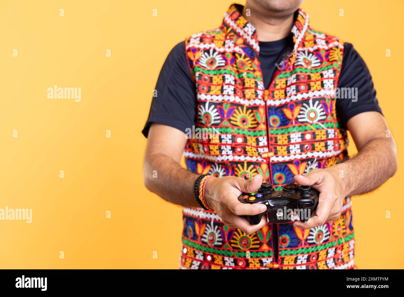 Close up shot of man wearing colorful vest playing videogames using ...