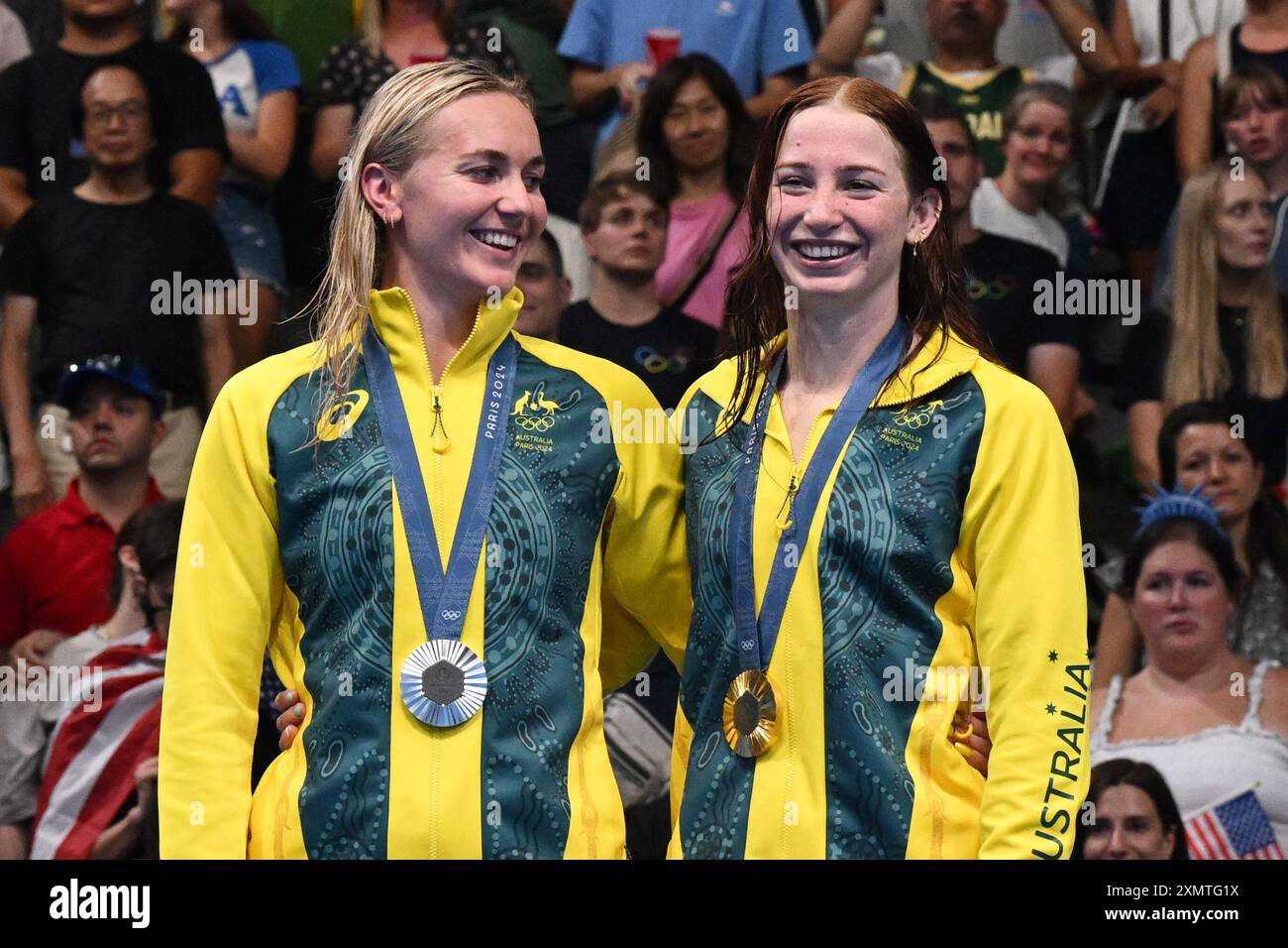 Paris, France. 29th July, 2024. Silver medallist Australia swimmer Ariarne Titmus (left) and ...