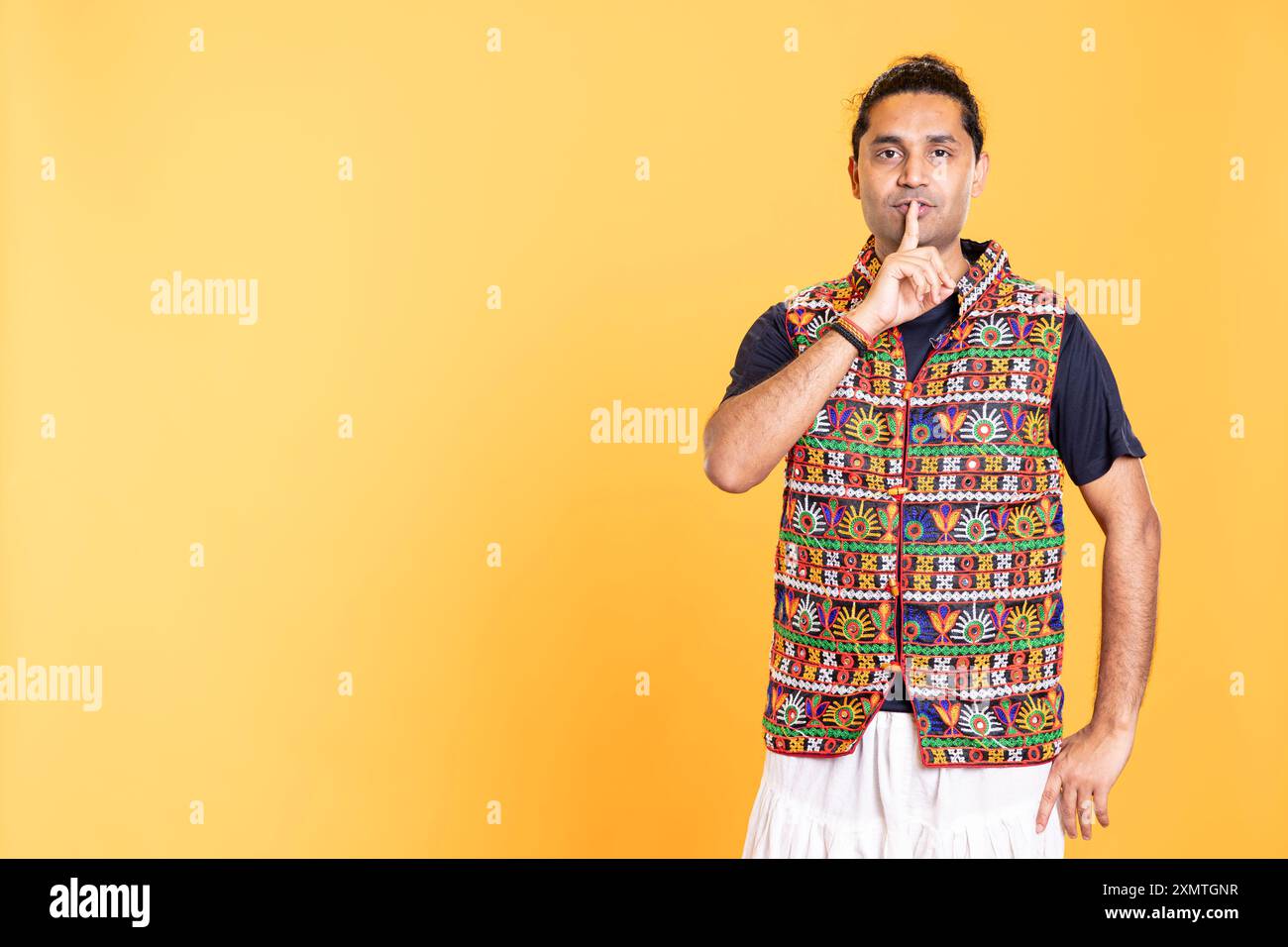 Annoyed man doing shushing hand gesturing, irritated by noise, having ...