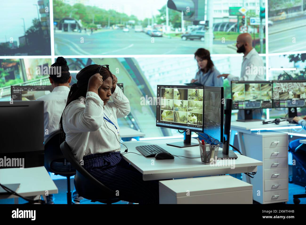 African american dispatch employee uses public satellite sensors to ...