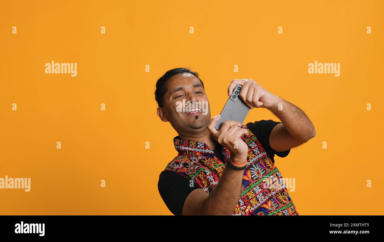 Happy indian man entertained videogames hi-res stock photography and ...