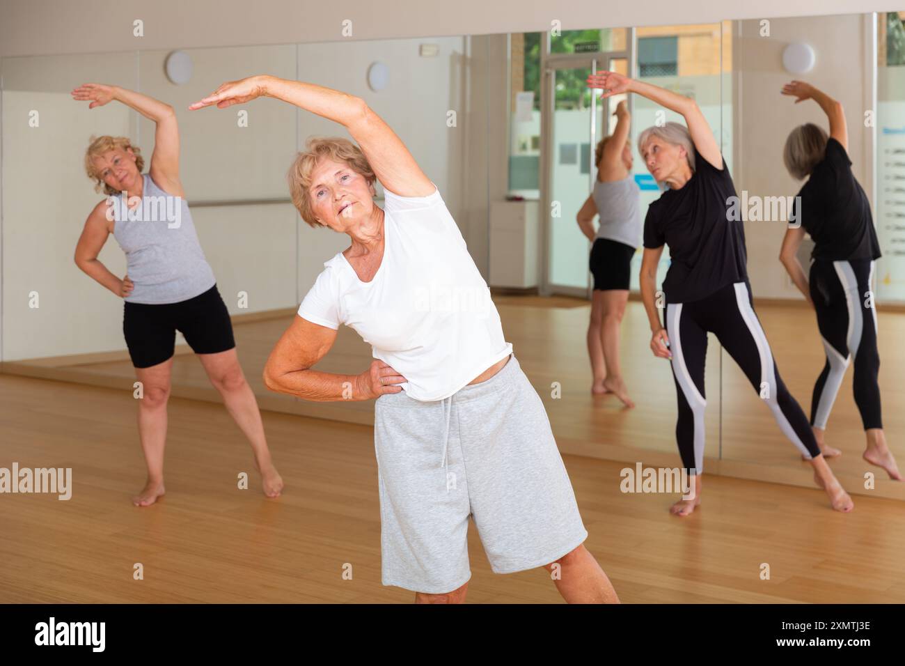 Mature women practice active dancing in the studio Stock Photo - Alamy