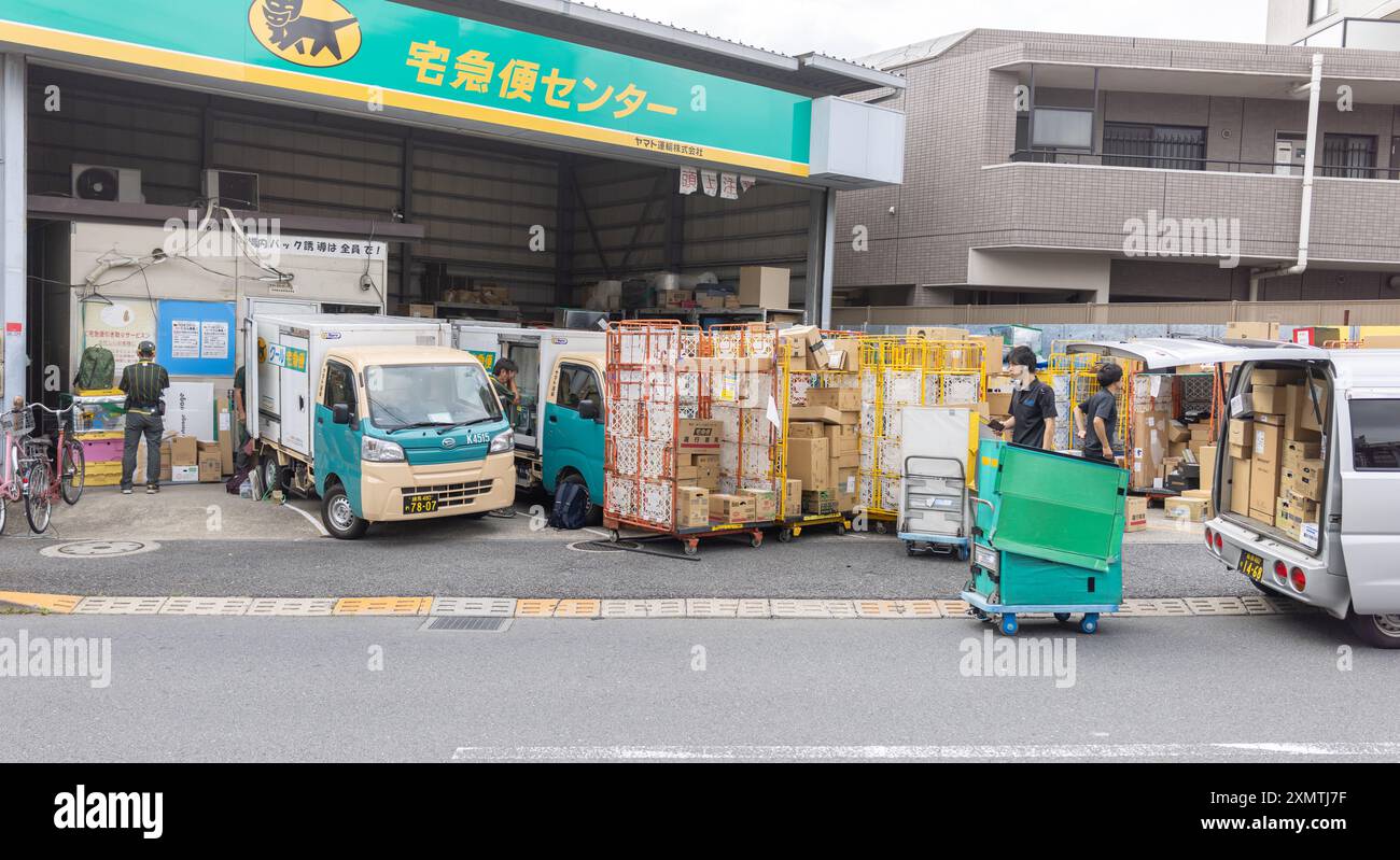 Nakano, Japan - May 26, 2024: A delivery drivers unloads trucks outside ...