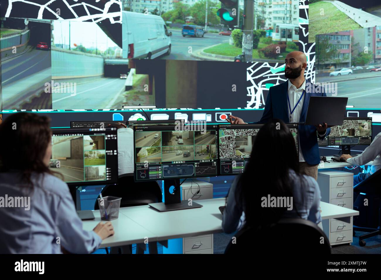 Middle eastern team leader gives instructions to his staff in control ...