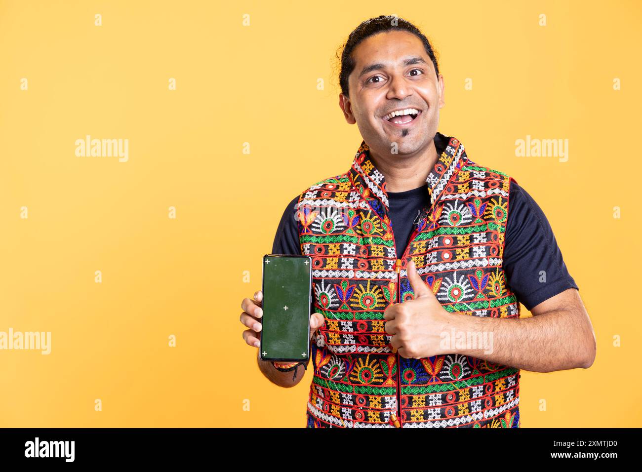 Portrait of excited content creator influencer smiling and doing thumbs ...