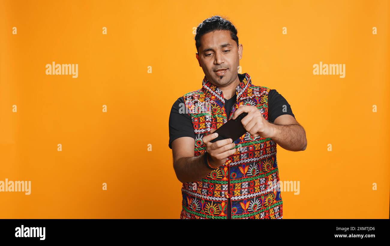 Happy indian man entertained videogames hi-res stock photography and ...