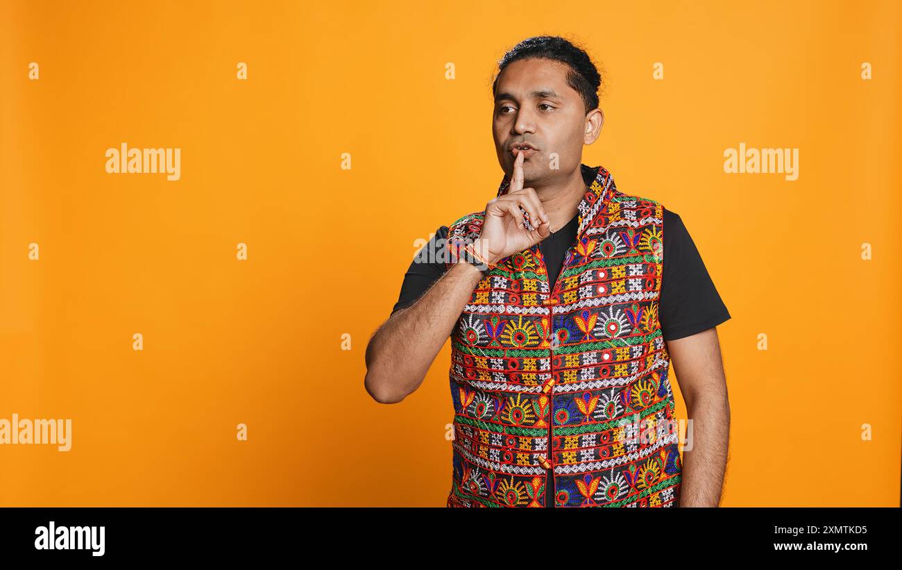 Annoyed indian man doing shushing hand gesturing, irritated by noise ...