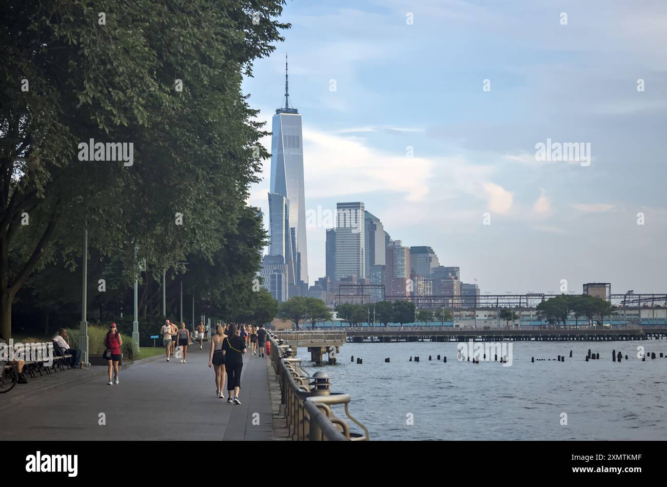 New York, NY - July 9, 2024: People walking on the west side highway greenway Hudson River Park ...