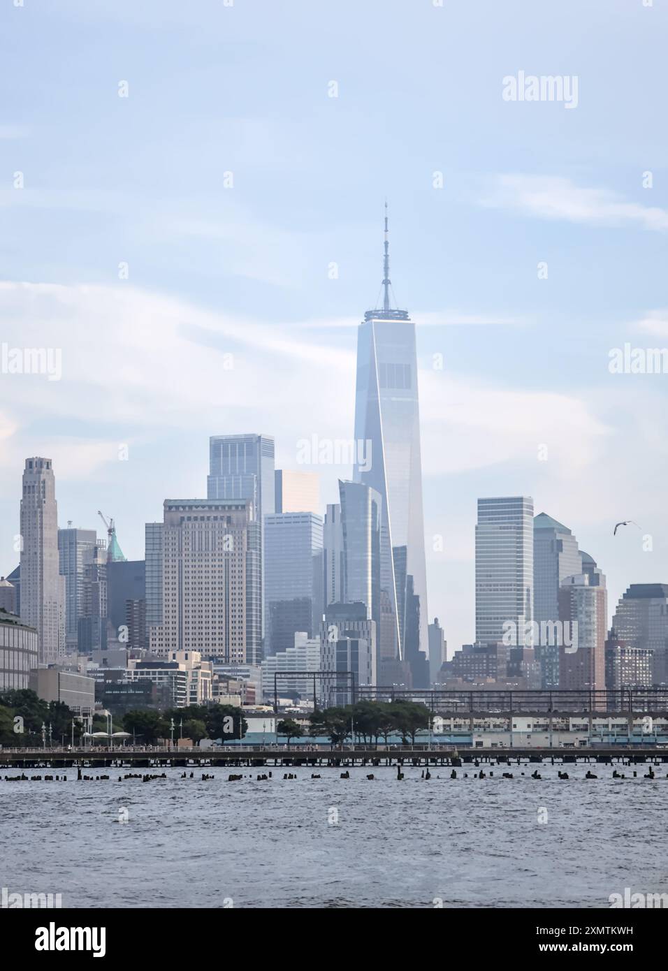 view of pier in front of downtown manhattan skyline near little island ...