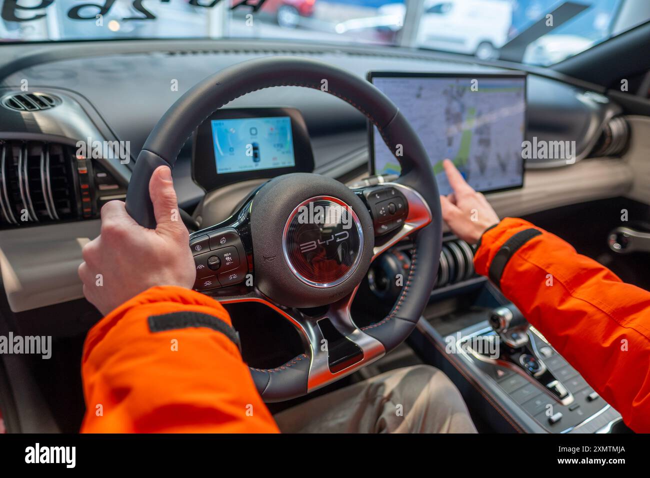 male hands on steering wheel, Interior, cockpit of BYD ATTO 3 Car in ...