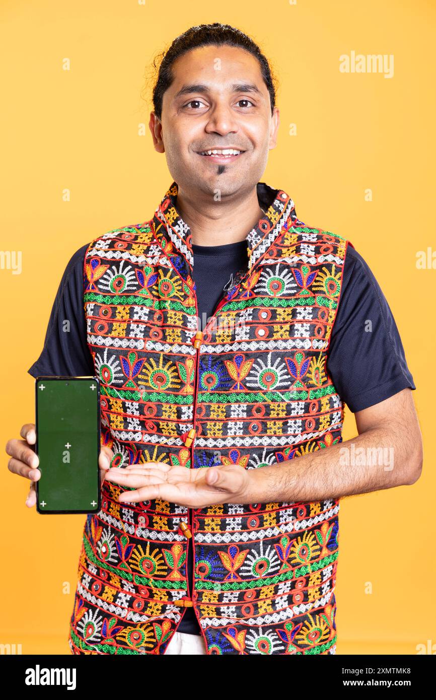 Content creator in traditional clothing recommending isolated screen ...