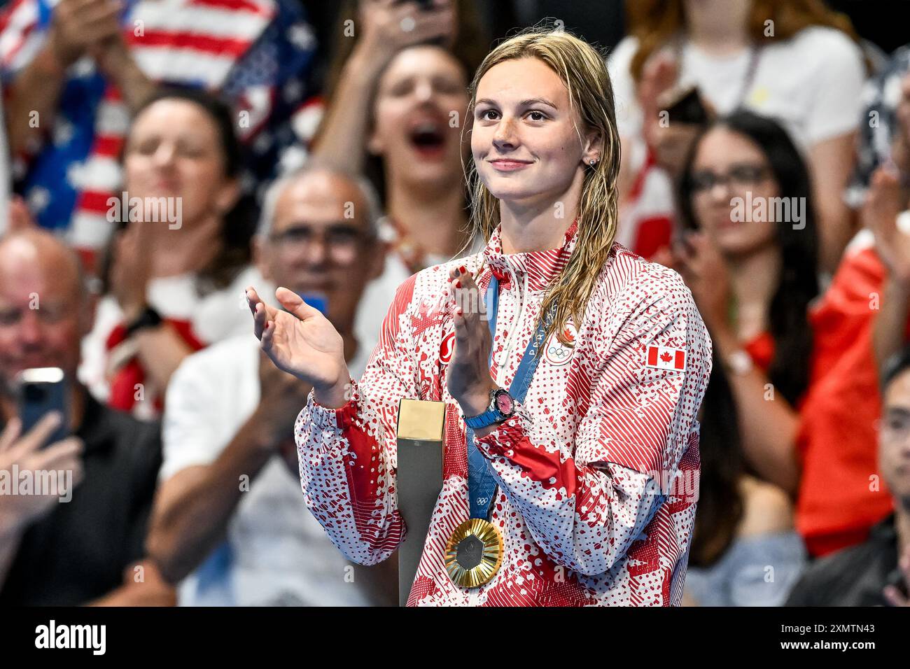 Paris, France. 29th July, 2024. Summer Mcintosh of Canada stands with the gold medal after ...
