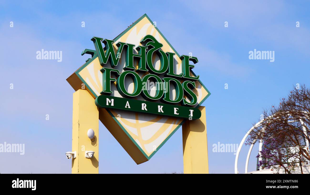 Whole Foods Market sign, a subsidiary of Amazon, American multinational ...